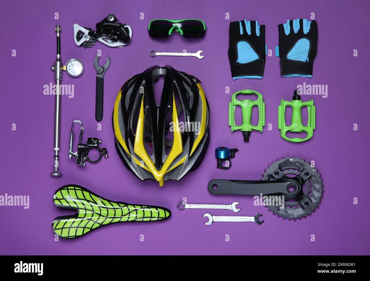 Set of different bicycle tools, accessories and parts on purple ...