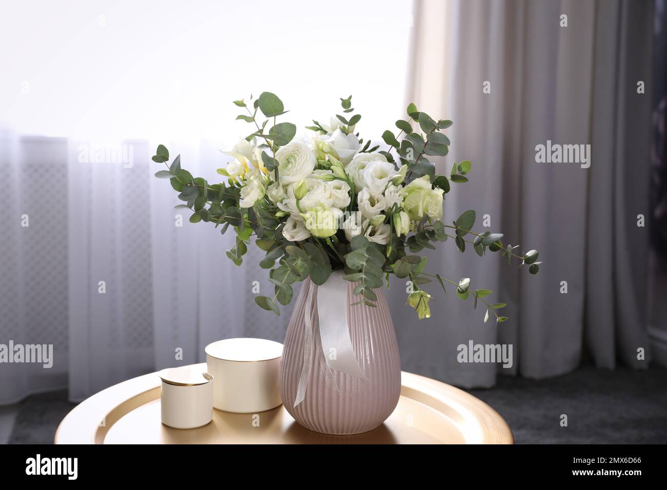 Beautiful bouquet of flowers on table in room. Stylish interior design ...