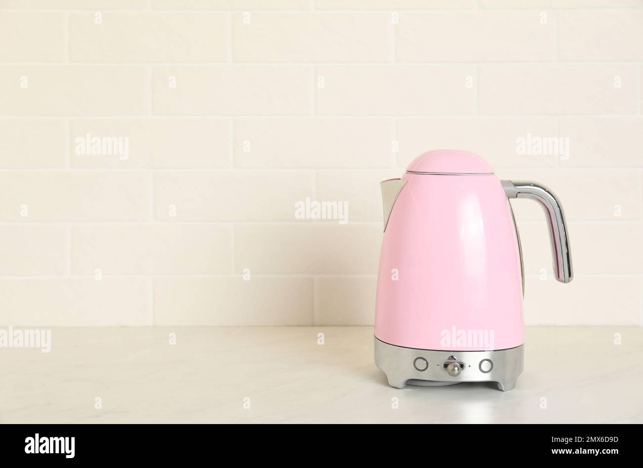 Modern electric kettle on counter in kitchen. Space for text Stock ...