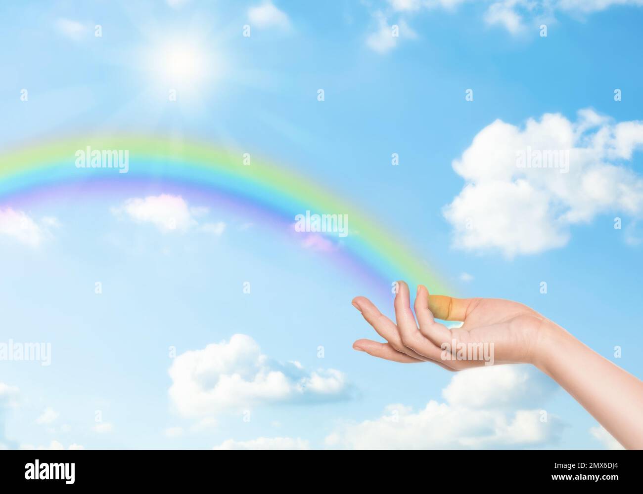 Woman and rainbow as source of healing energy on sunny day, closeup ...