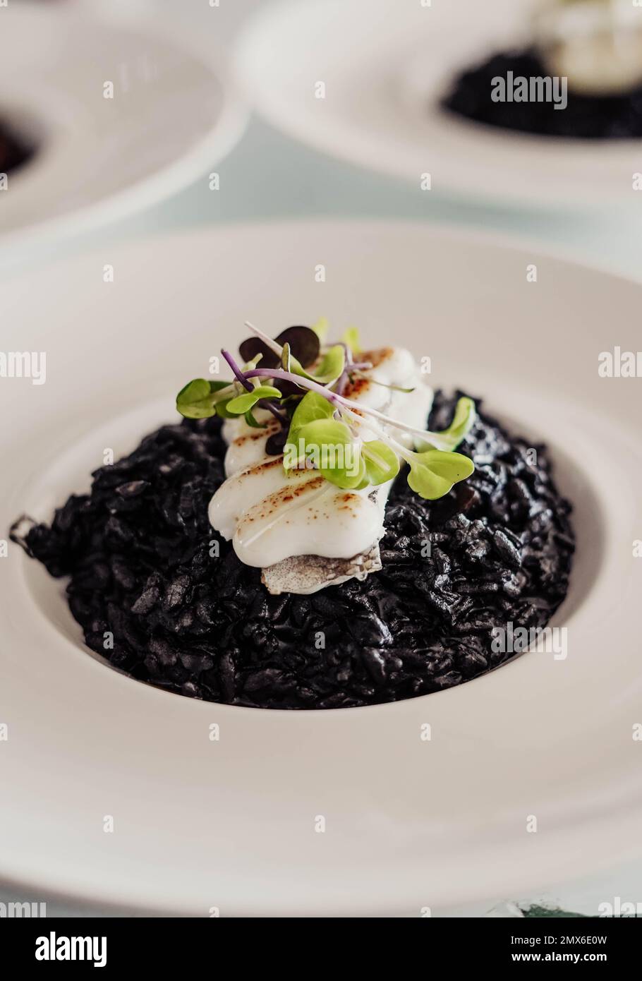Black rice with cuttlefish and squid ink Stock Photo - Alamy