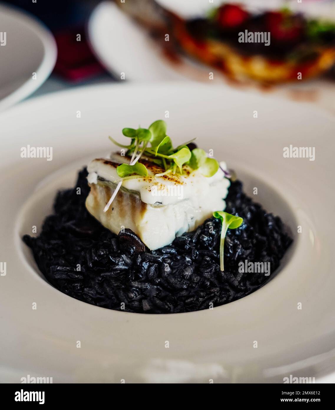 Black rice with cuttlefish and squid ink Stock Photo - Alamy