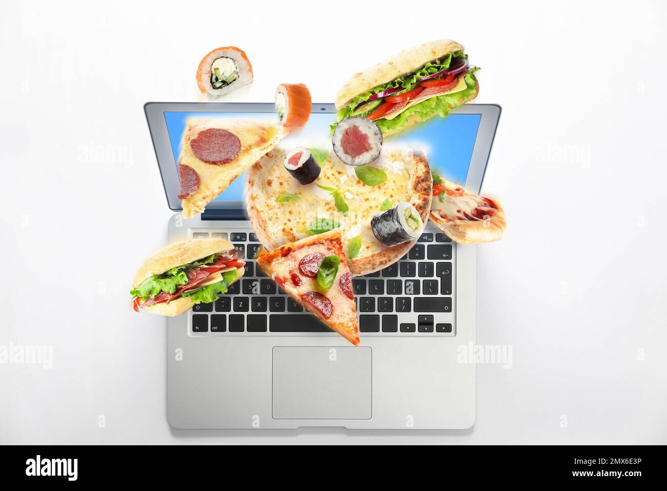 Modern laptop with open page of online food delivery service on white ...