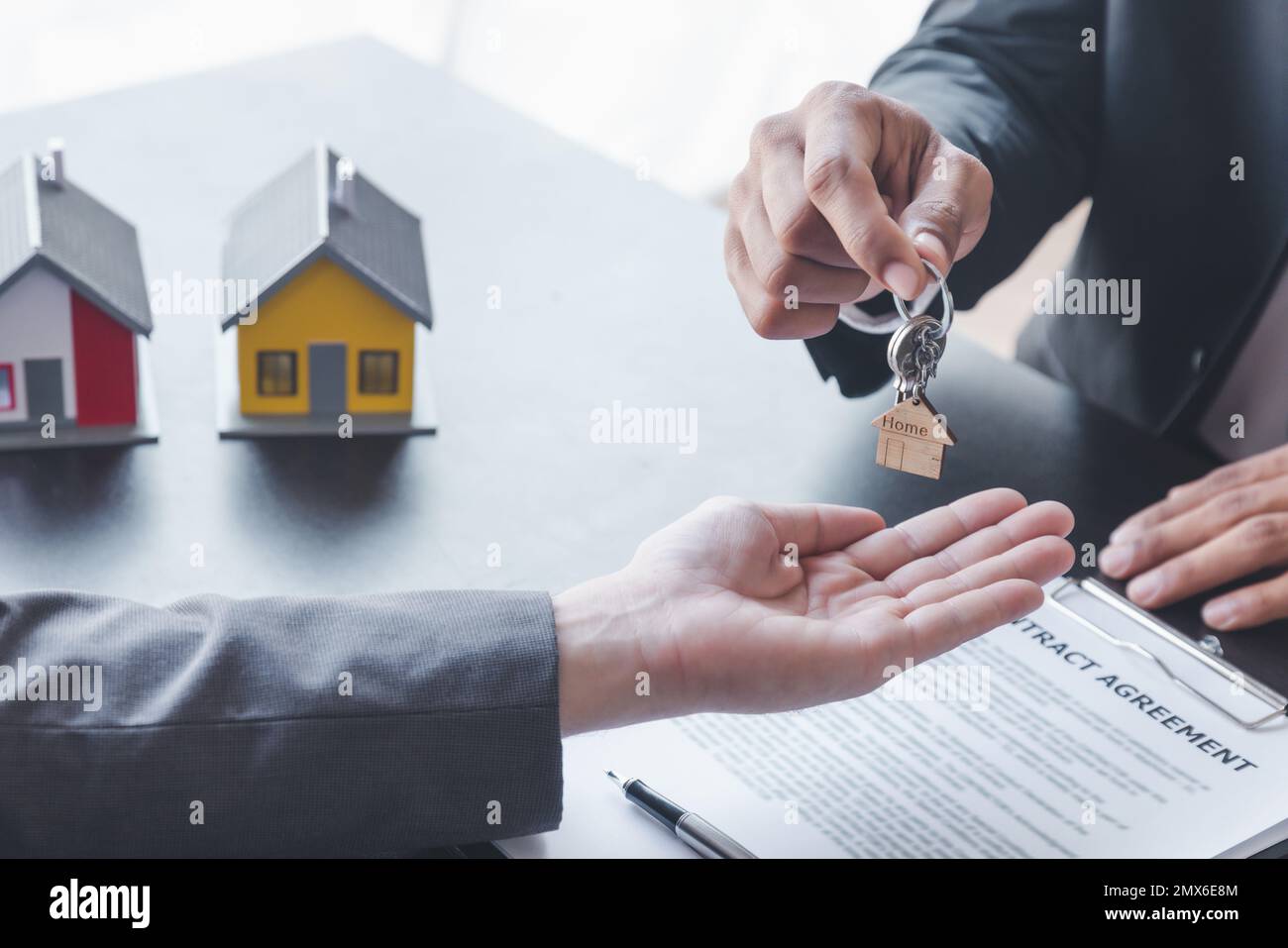 Home sales,home rental and real estate concept.Hands of estate agent ...