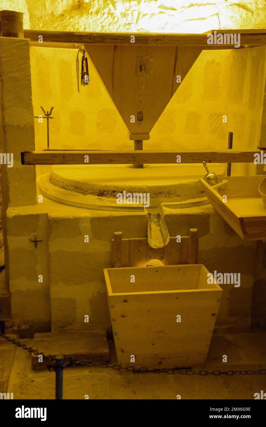 ancient water mill upper part of the millstone for grinding grain and ...