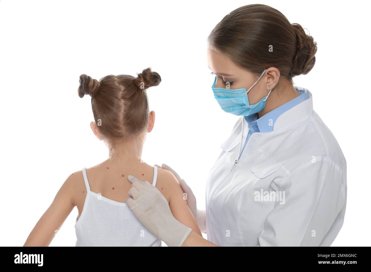 Doctor examining little girl with chickenpox on white background ...
