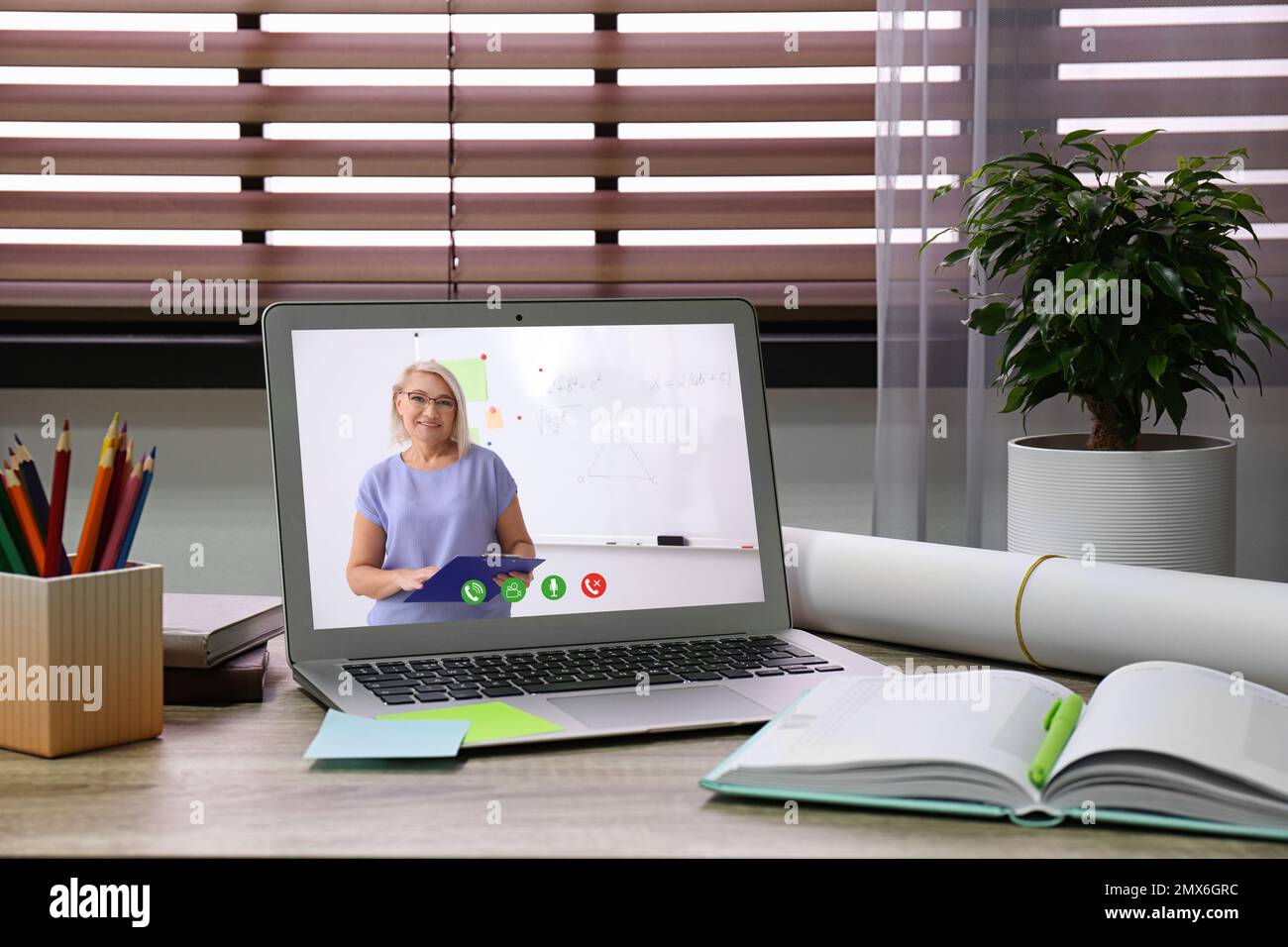 Modern laptop on wooden desk indoors. Online learning Stock Photo - Alamy