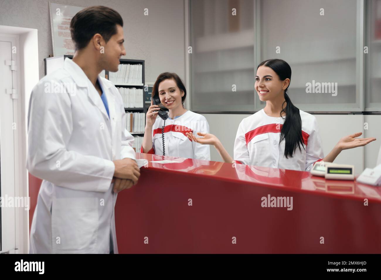 Reception of modern surgery clinic with working staff Stock Photo - Alamy