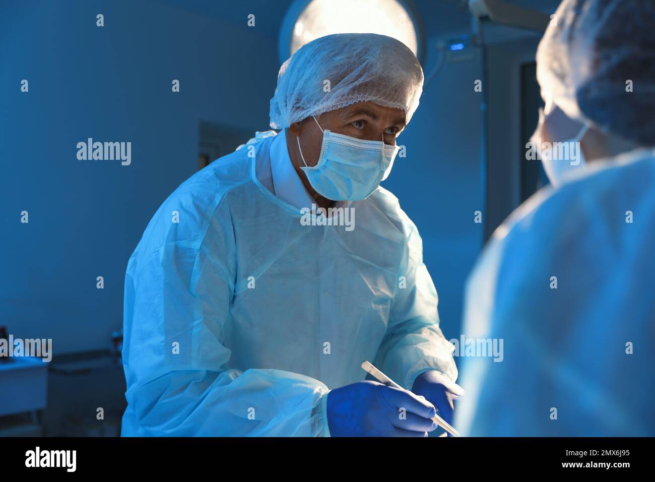 Team of professional doctors performing operation in surgery room Stock ...