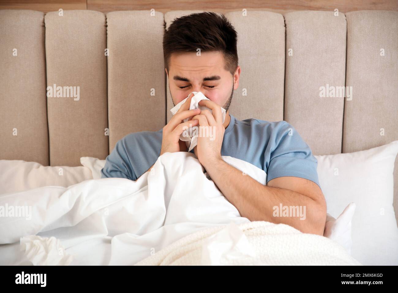 Sick young man in bed at home. Influenza virus Stock Photo - Alamy