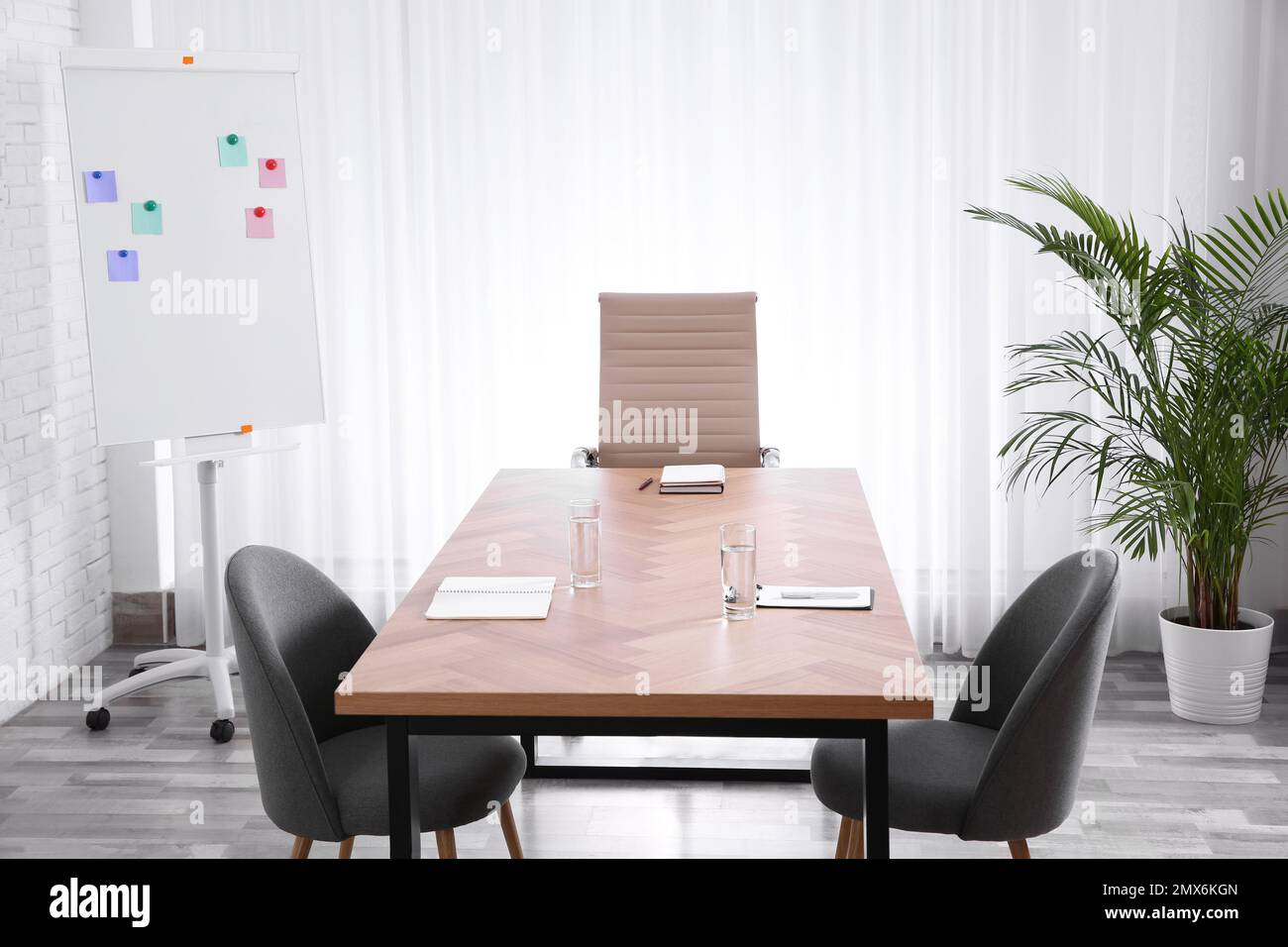 Interior of modern office with table and chairs Stock Photo - Alamy