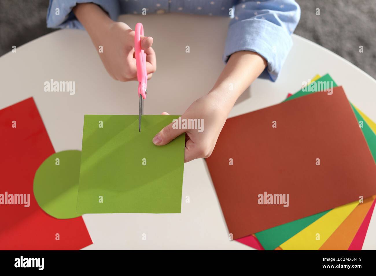 Little girl making greeting card at table indoors, top view. Creative ...
