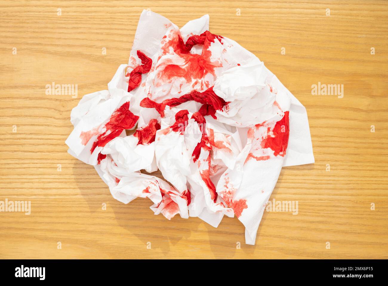 bloody tissue on a wood table Stock Photo - Alamy