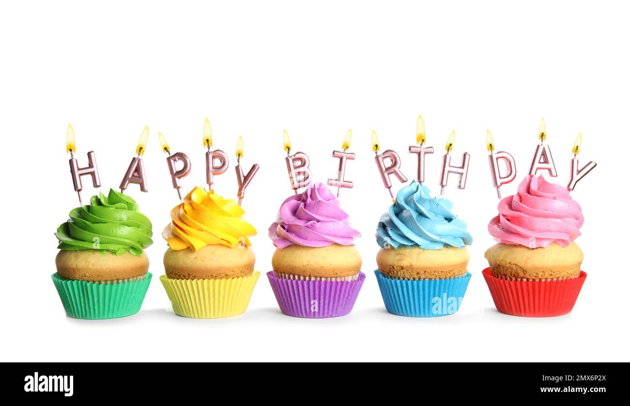Birthday cupcakes with candles on white background Stock Photo - Alamy