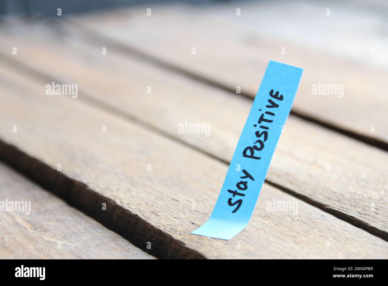 Motivational quotes inscription on a tag. Stay Positive Stock Photo - Alamy