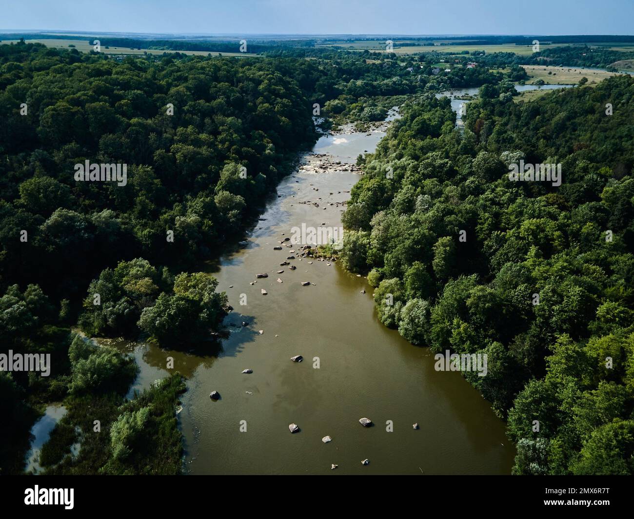Aerial view of Southern Bug river and granite mountains, summer ...
