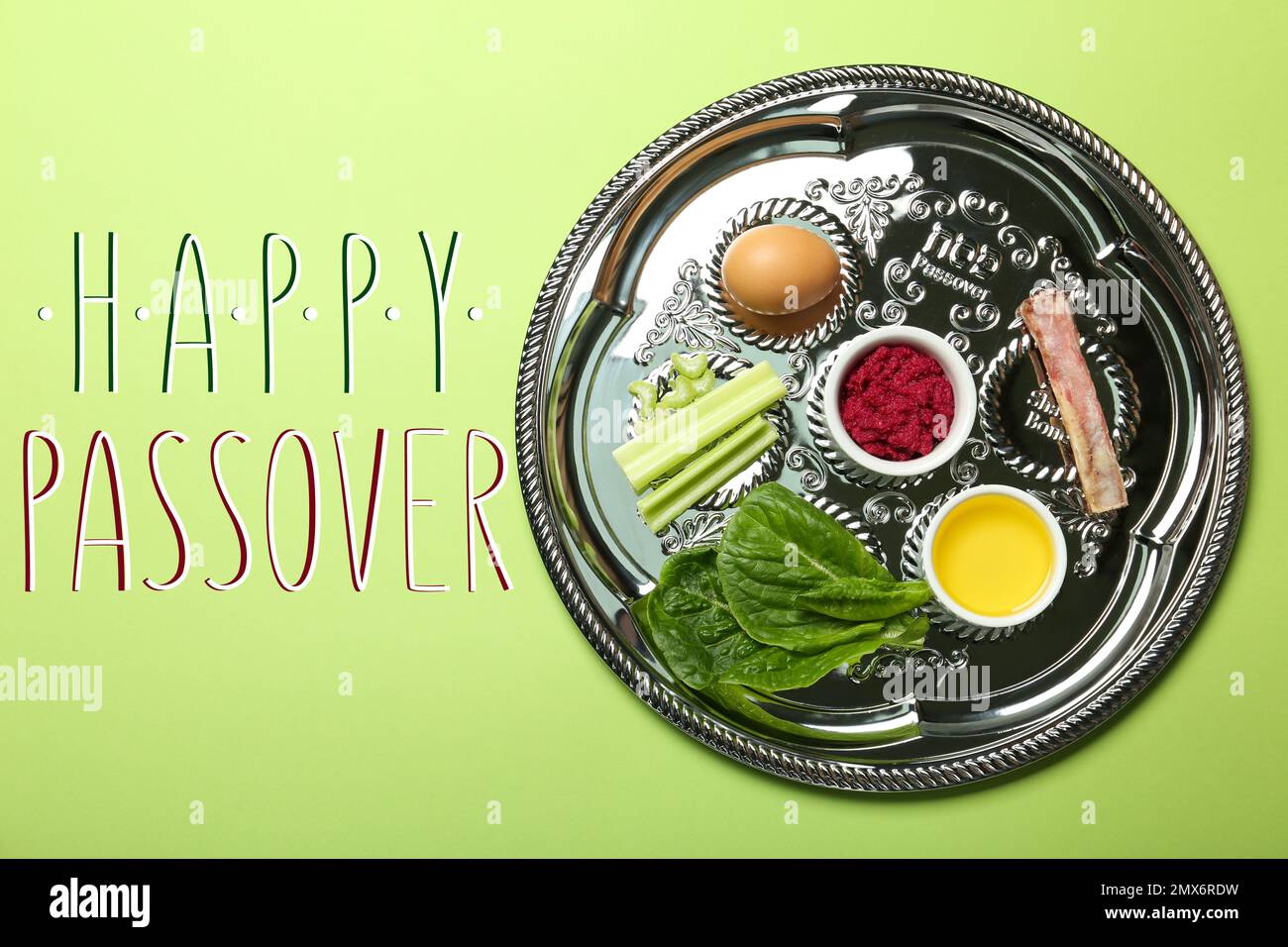 Passover Seder plate (keara) with symbolic meal on green background ...