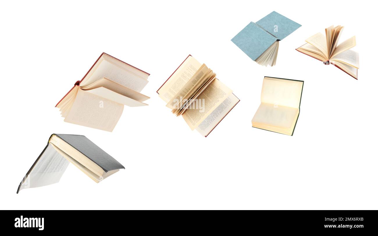 Old hardcover books flying on white background Stock Photo - Alamy
