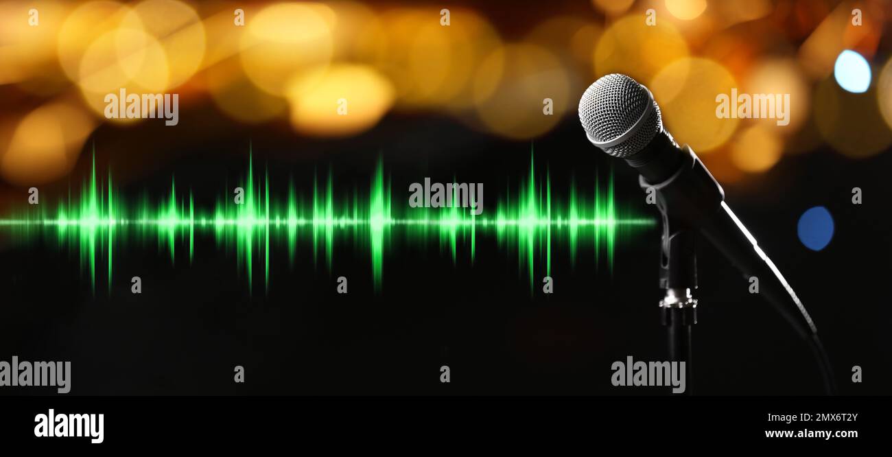 Microphone and radio wave on dark background, bokeh effect. Banner design Stock Photo - Alamy