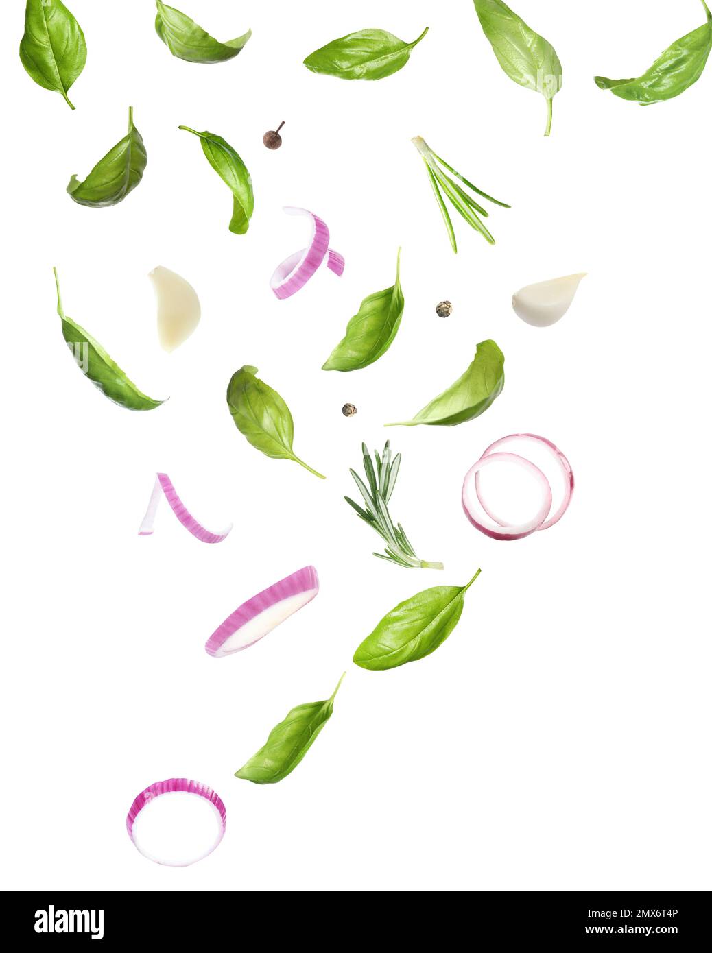 Basil leaves and other ingredients falling on white background Stock ...