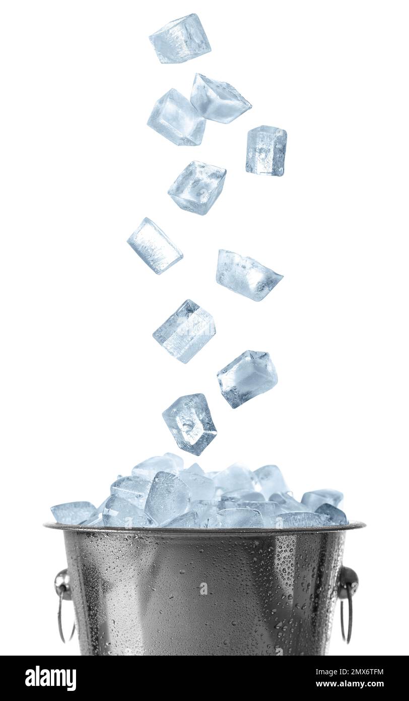 Ice cubes falling into bucket on white background Stock Photo - Alamy