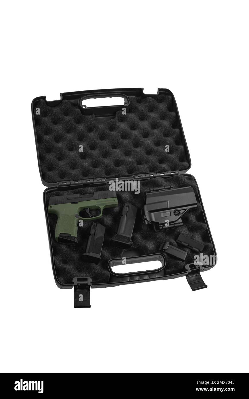 A modern small semi-automatic pistol with a holster and additional ammo ...