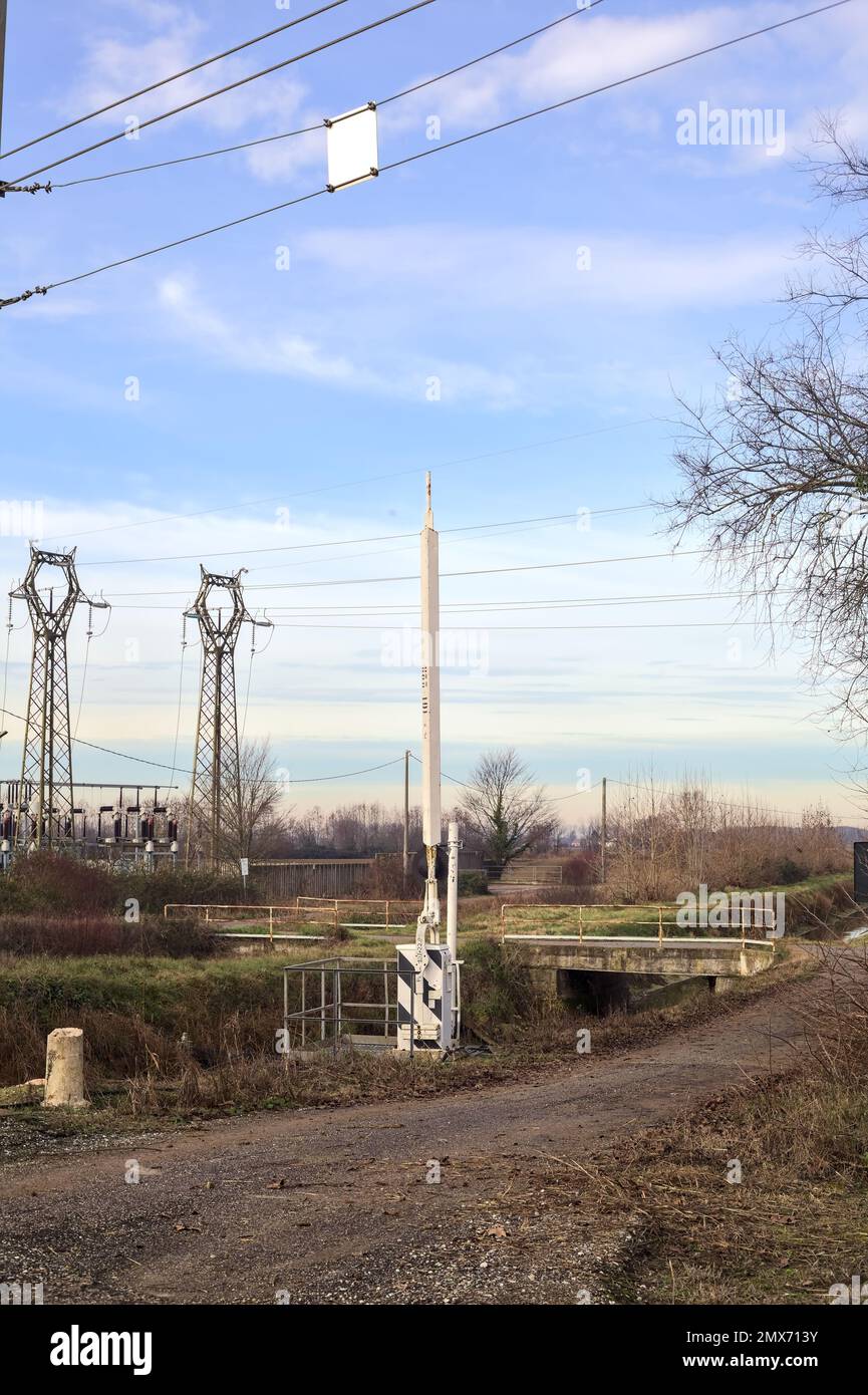 Small country road with a bridge over a stream of water next to a ...