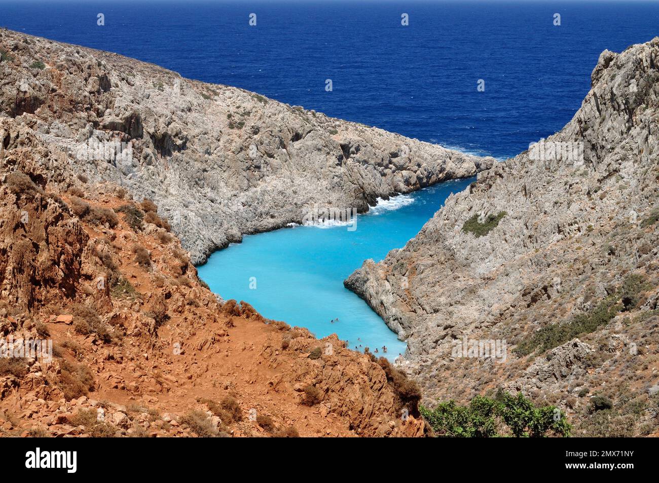 Little lagoon between the steep cliffs of the peninsula - Crete Island ...