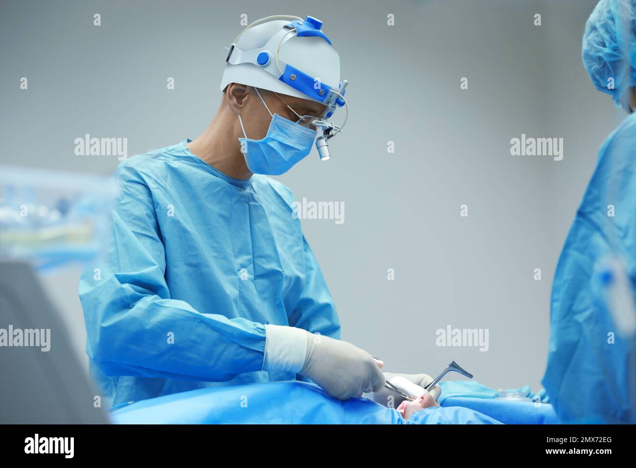 Professional doctors performing operation in surgery room Stock Photo ...