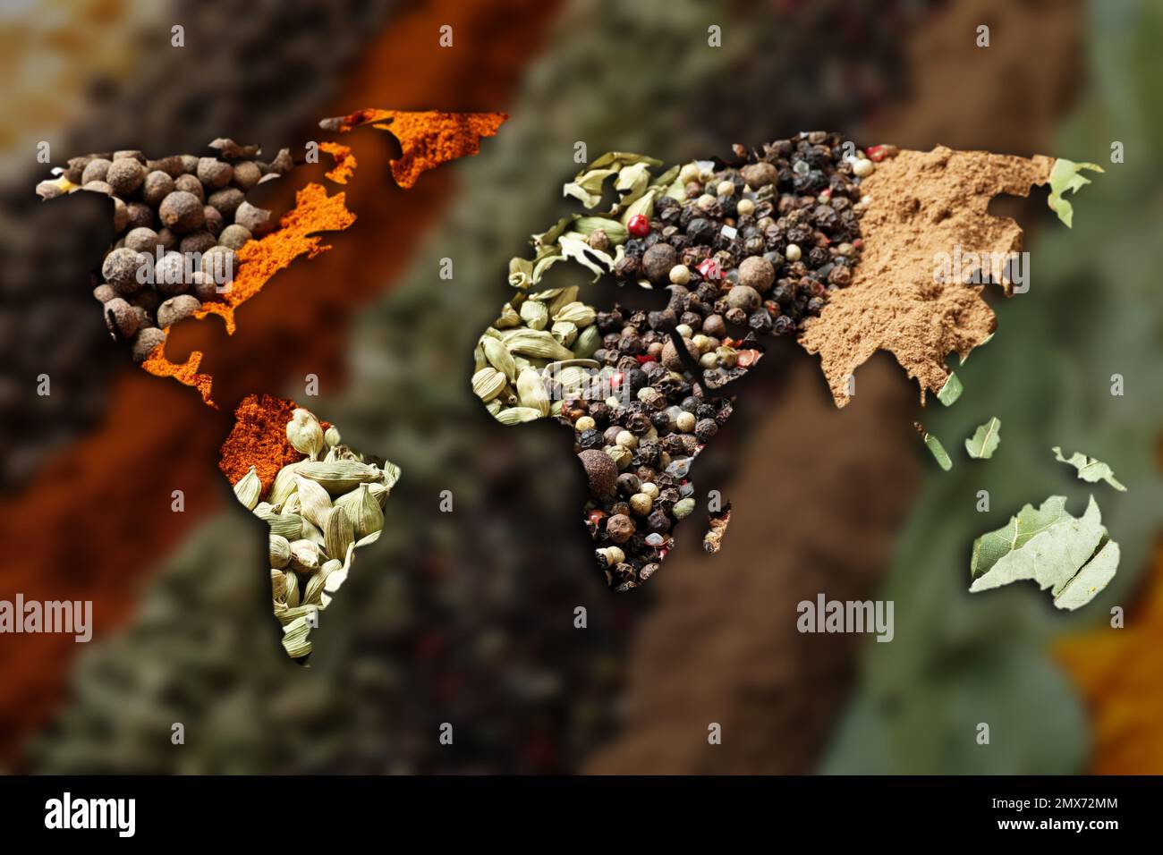 Double exposure of world map and different spices on blurred background ...