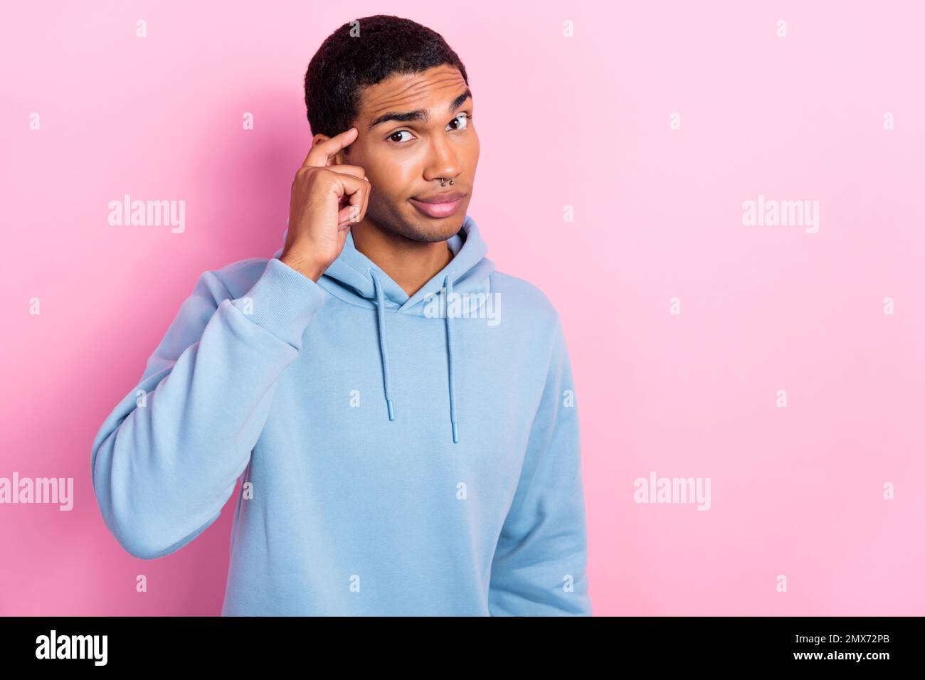 Photo of trendy wearing stylish blue hoodie man finger touch head moody ...