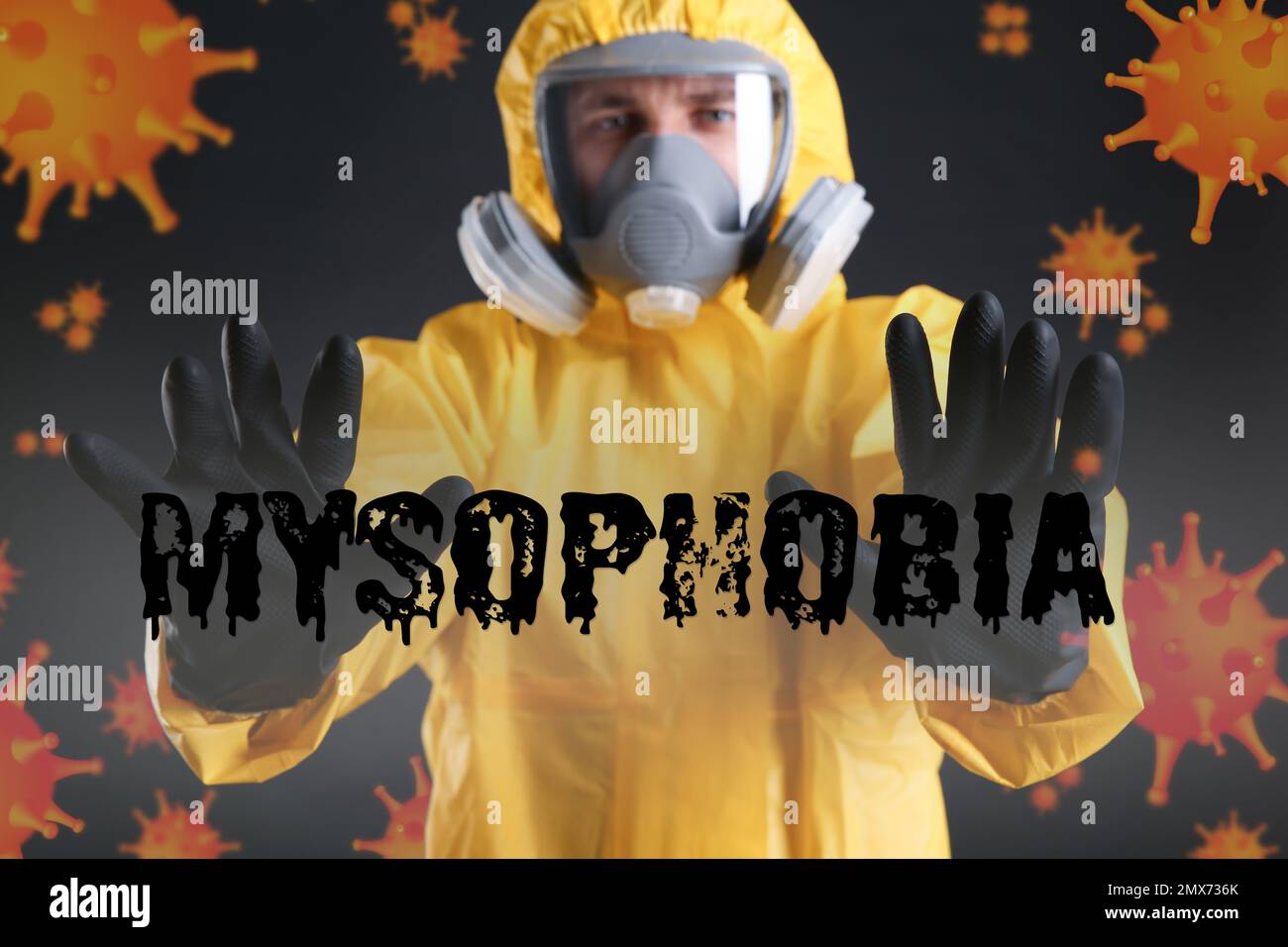 Man in chemical protective suit against black background. Mysophobia ...