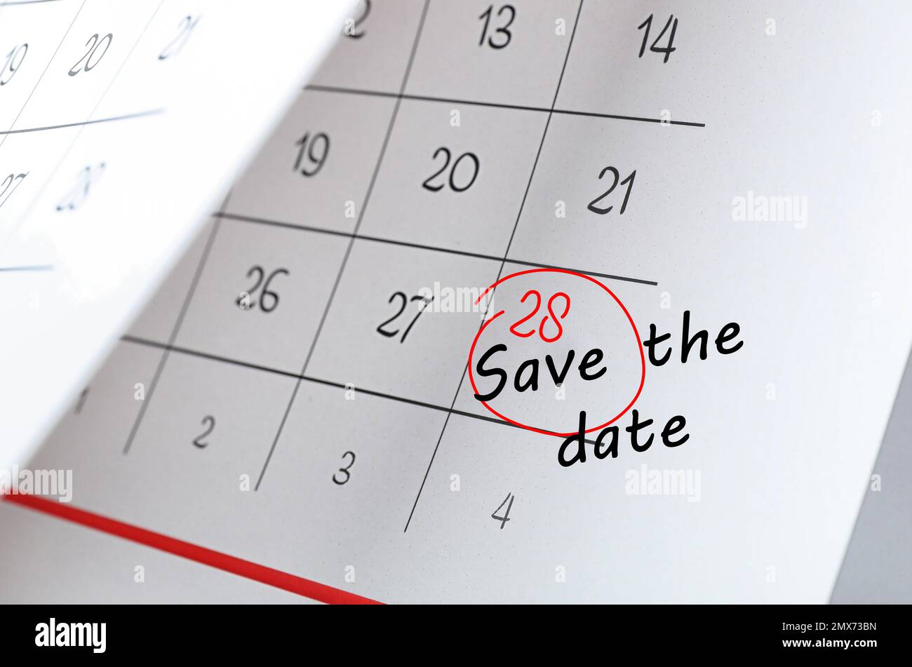 Paper calendar with phrase SAVE THE DATE, closeup Stock Photo - Alamy