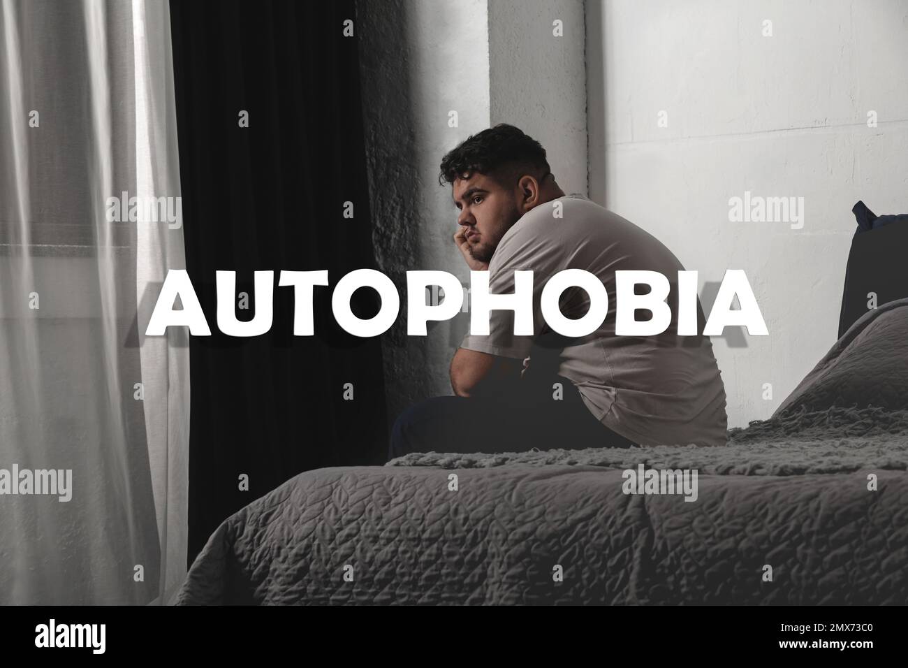 Depressed overweight man sitting alone on bed at home. Autophobia ...