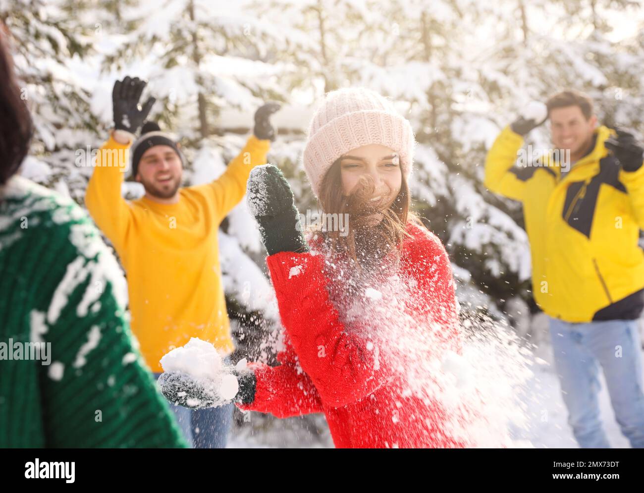 Man woman couple throwing snowballs hi-res stock photography and images ...
