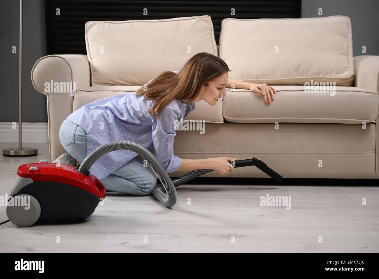 Woman using vacuum cleaner hi-res stock photography and images - Alamy