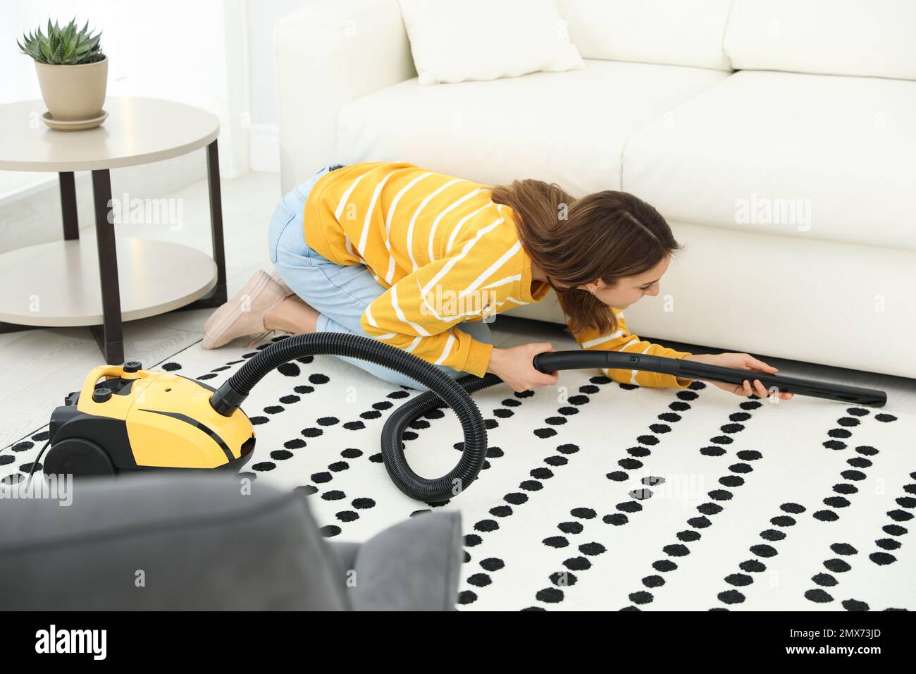 Woman using vacuum cleaner hi-res stock photography and images - Alamy