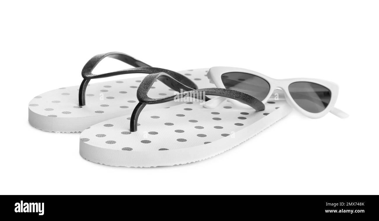 Stylish flip flops and sunglasses on white background Stock Photo - Alamy