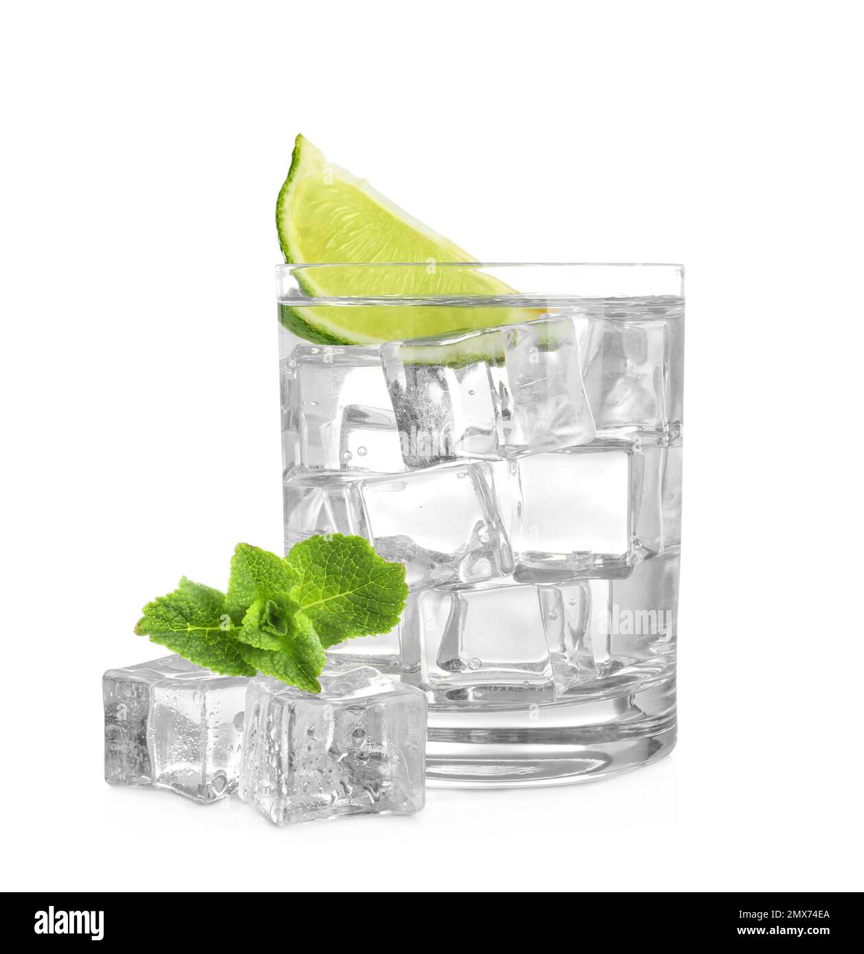 Glass of refreshing drink with ice cubes on white background Stock ...