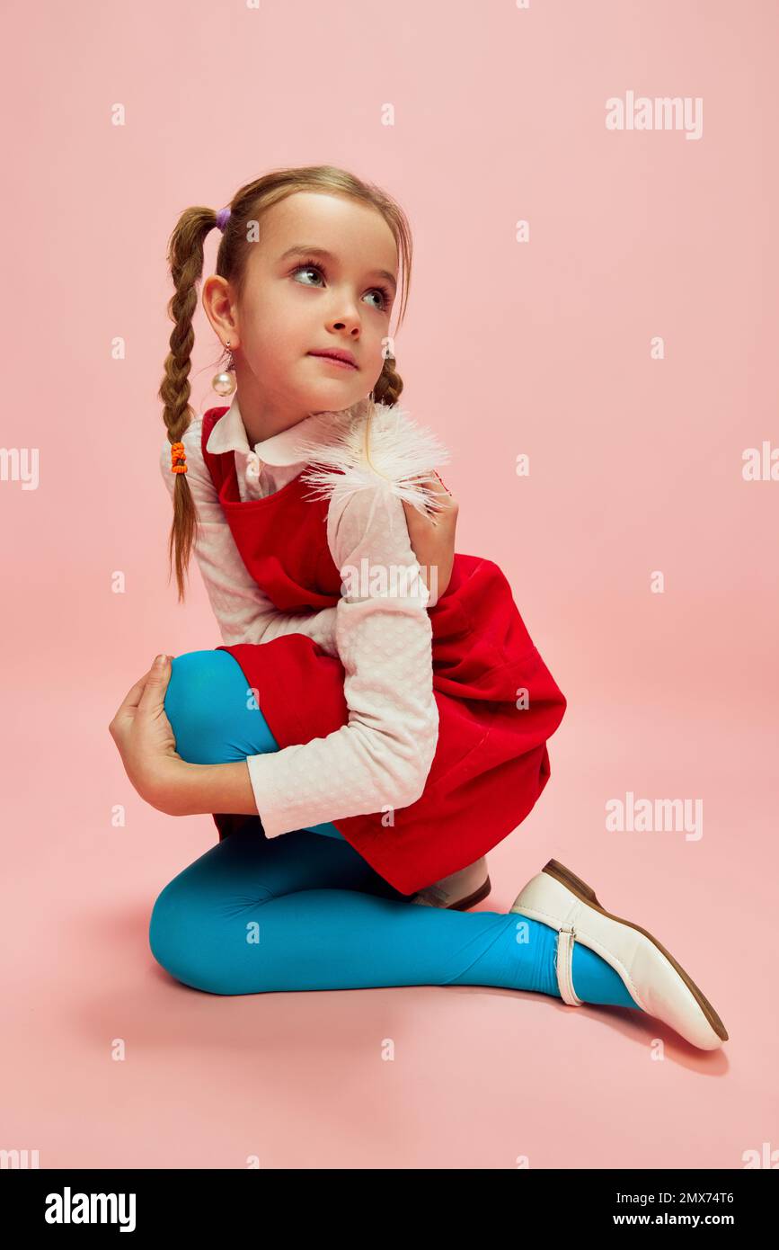 Beautiful, cute, lovely kid. Girl, child in red dress and blue tights ...