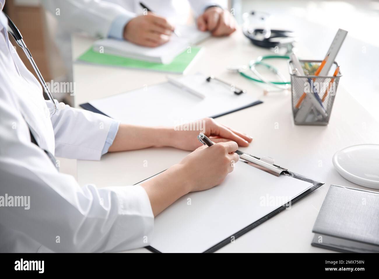 Closeup desk doctors office hi-res stock photography and images - Alamy