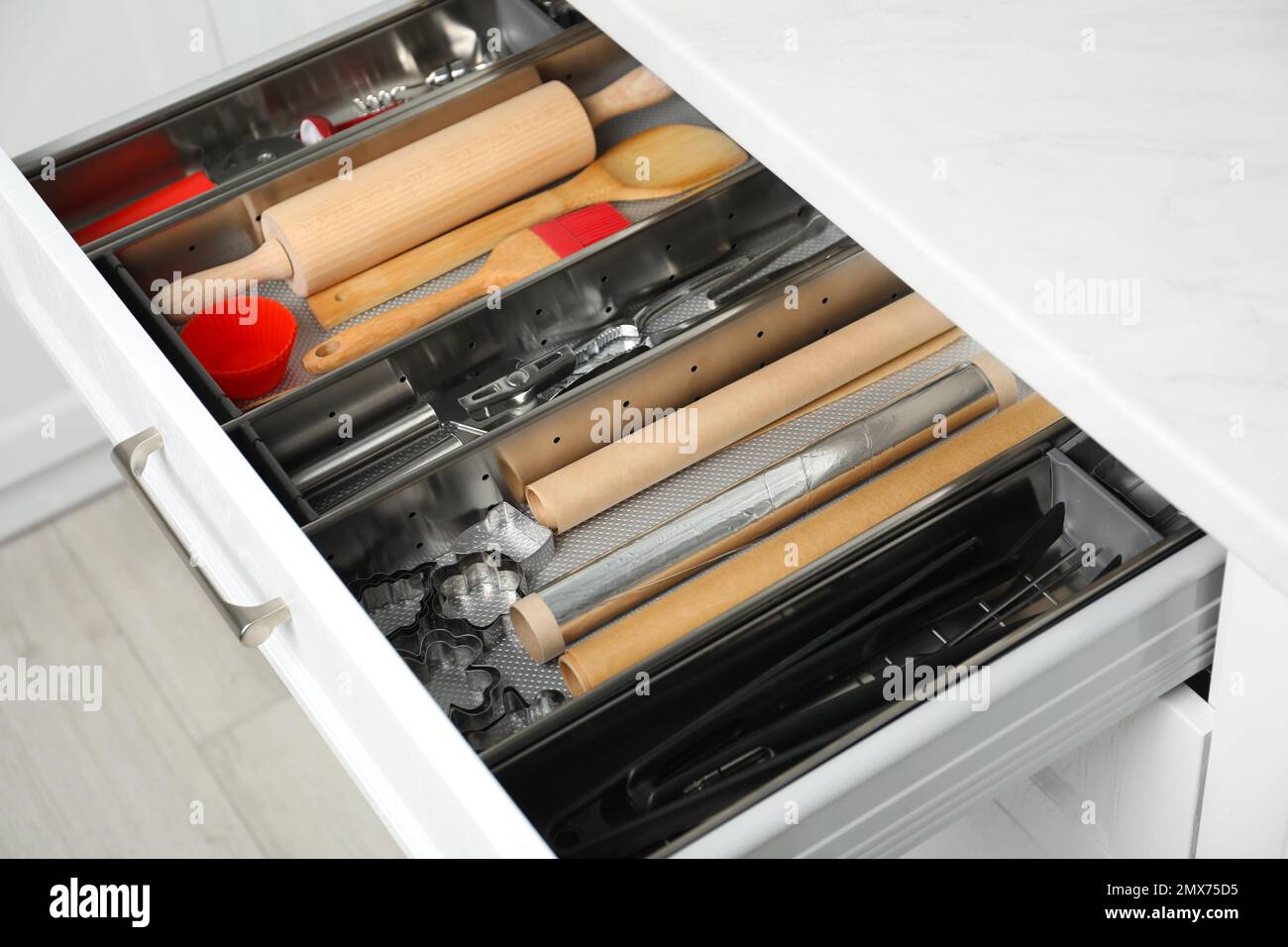 Different utensils in open desk drawer indoors Stock Photo - Alamy