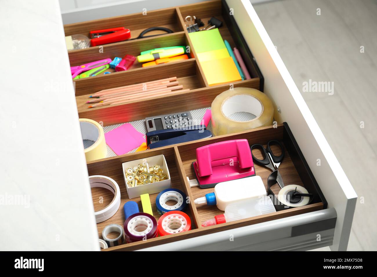 Different stationery in open desk drawer indoors Stock Photo - Alamy