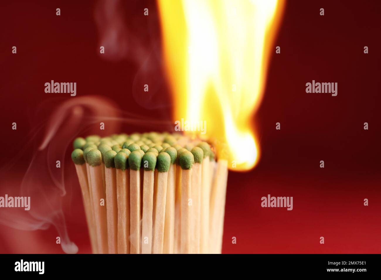 Group of burning matchsticks on red background, closeup Stock Photo - Alamy