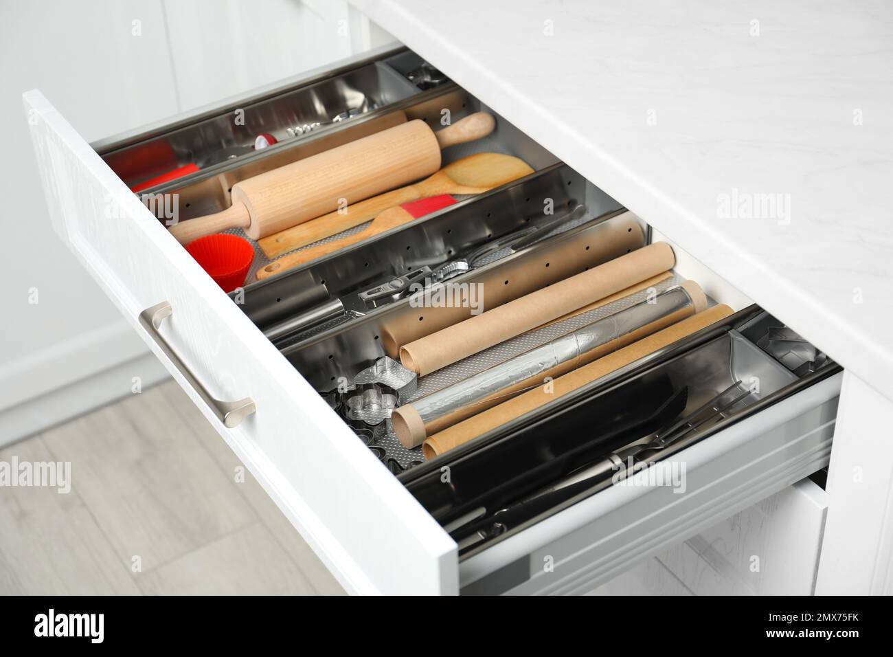 Different utensils in open desk drawer indoors Stock Photo - Alamy