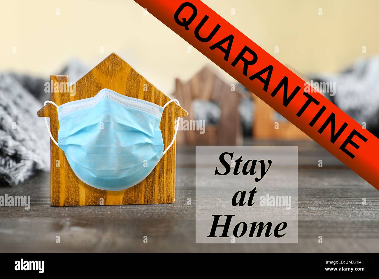 Stay at home during coronavirus quarantine. Wooden house model with ...