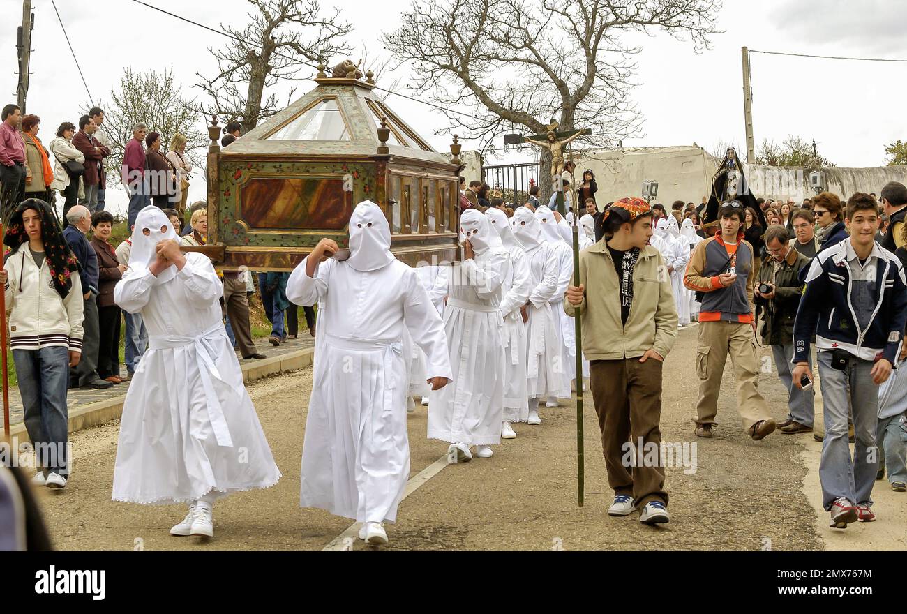 Holy Week in Zamora, Spain. Penitents carry the urn of Christ down a ...
