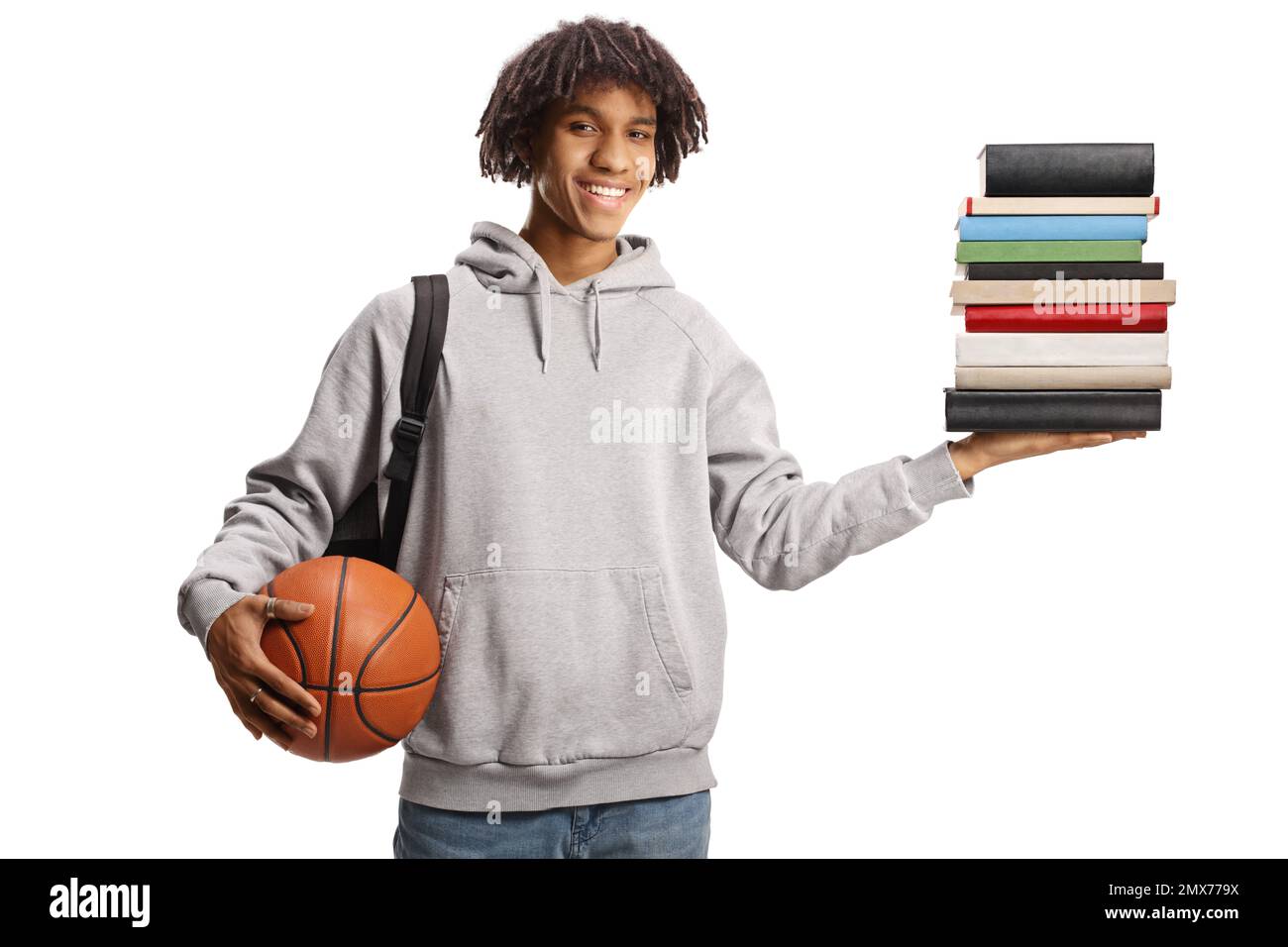 African american male student holding a basketball and a pile of books ... African american male student holding a basketball and a pile of books ...