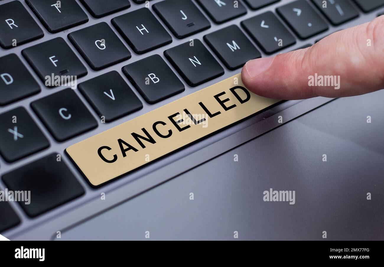 Hand writing sign Cancelled. Business overview decide or announce that ...