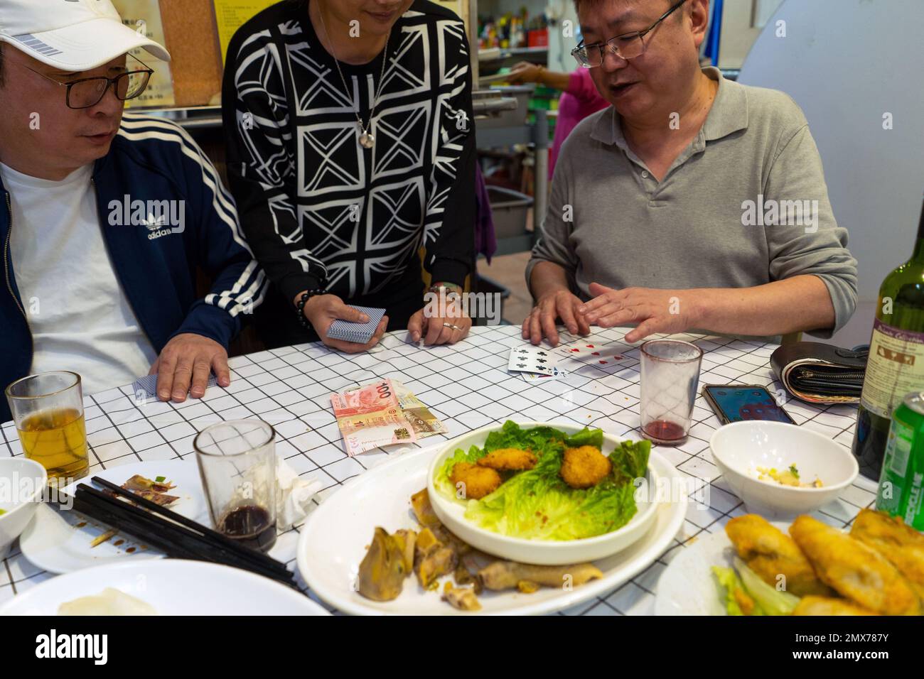 Hong Kong - Adult people gambling at restaurant - December 2022 Stock ...